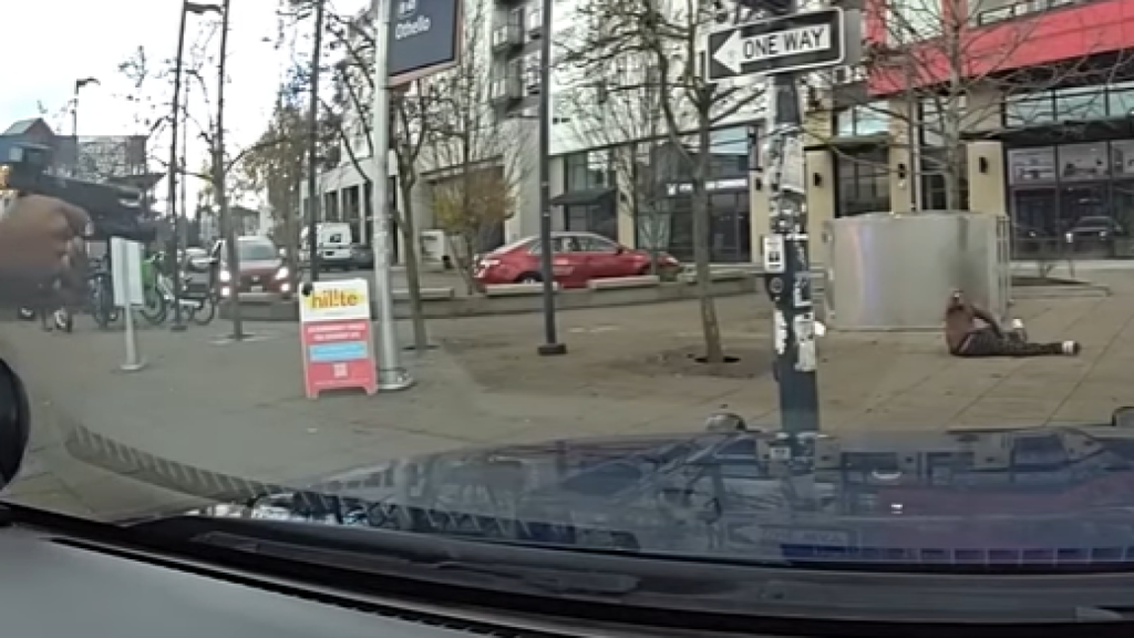 BWC: Man walking down street with handgun points it at Seattle officers ...